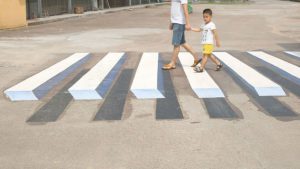 Optical Illusions Painted on the Road Fool Drivers to Slow Down ...